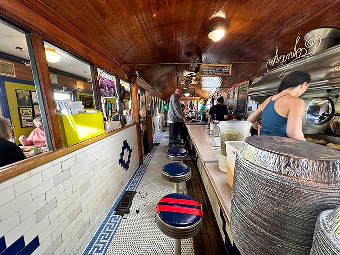 The narrow passage where breakfast dreams come true. Those counter stools have witnessed more life stories than most therapists.