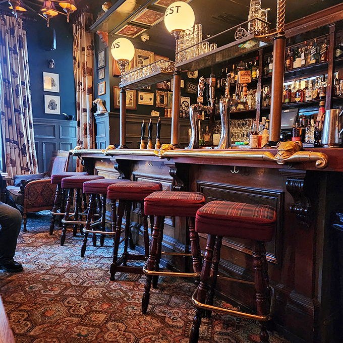 This isn't just a bar&mdash;it's a time capsule with taps. Rich wood, gleaming bottles, and those classic stools practically whisper stories of conversations past while inviting you to start your own.