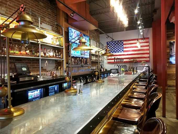 A bar counter that promises good conversations and better beer. The American flag watches over proceedings like a patriotic guardian of good times.