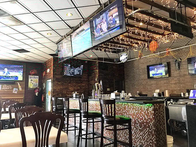 The bar area: where TVs show sports but everyone's real attention is on the seafood being delivered to neighboring tables.