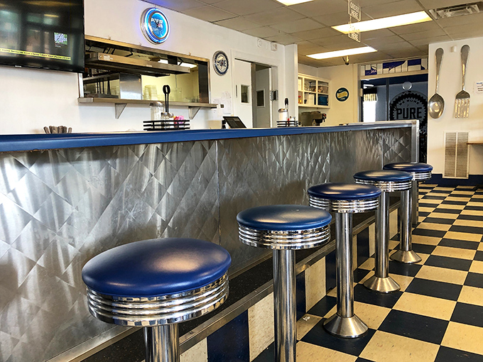 Chrome stools lined up like soldiers ready for the breakfast battle. The counter where strangers become friends over coffee and pie.