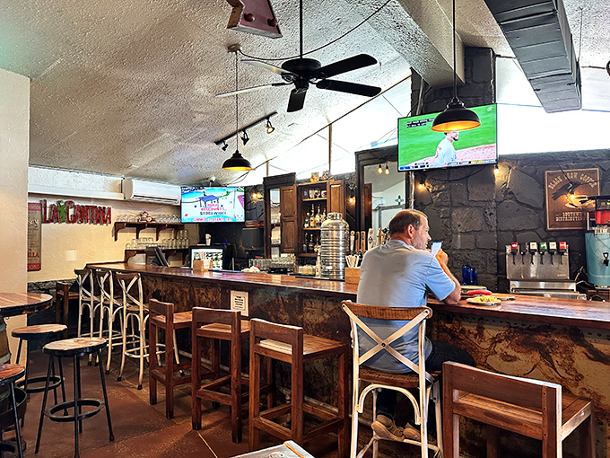 The bar area strikes that perfect balance between "come as you are" casual and "seriously good food" atmosphere that makes regulars out of first-timers.
