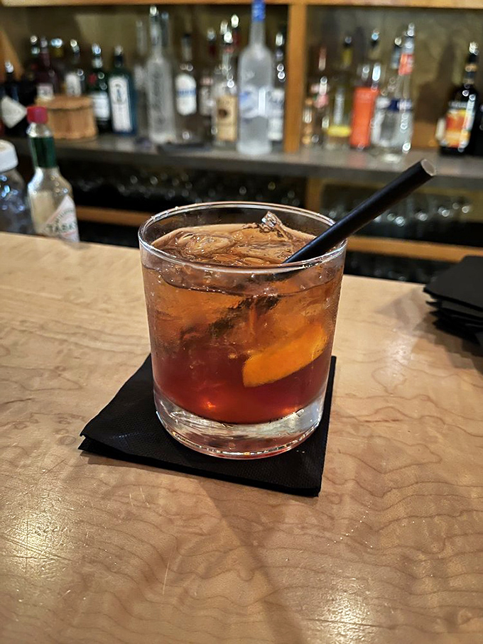 An old fashioned sits patiently on its throne of marble&mdash;amber liquid, orange peel, and the promise of a perfectly relaxed evening.