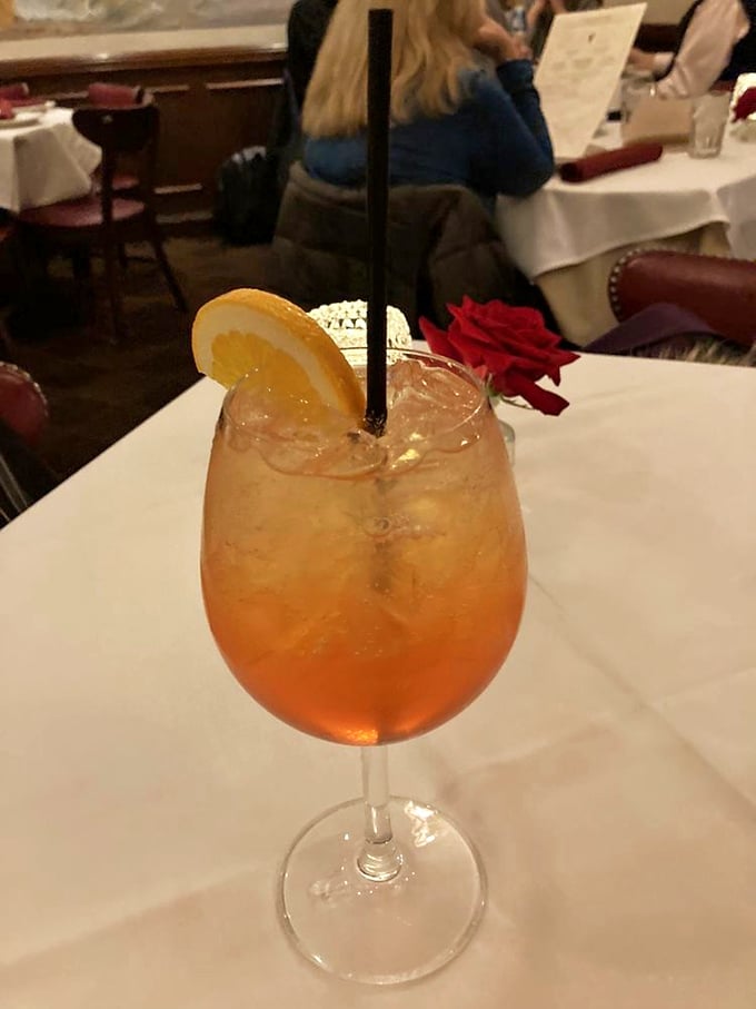 The kind of cocktail that makes you want to settle in for the evening. Amber liquid, citrus garnish, and a rose&mdash;because romance isn't dead at Gene & Georgetti.