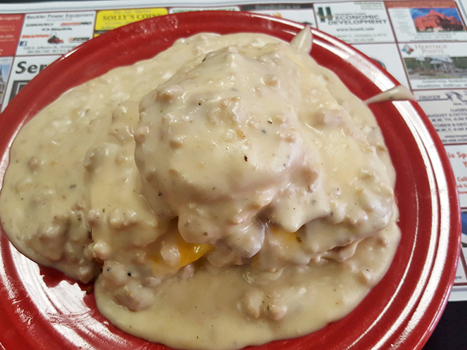 Biscuits and gravy: where breakfast meets Southern comfort in a pool of peppery goodness that hugs those biscuits like they're long-lost friends.