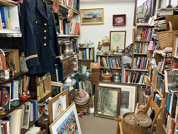 A literary treasure trove where first editions mingle with vintage paperbacks. That naval uniform has tales to tell too.