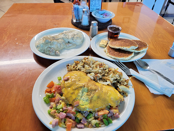 Perfect sunny-side-up eggs alongside hash browns that achieved the golden-brown crispiness that breakfast dreams are made of.