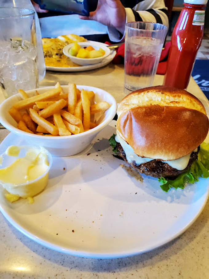 When lunch calls, this burger answers with juicy perfection and golden fries that crackle with each bite. Midday magnificence.
