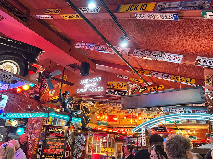 License plates from across America adorn the ceiling—each representing a pilgrimage someone made before discovering this meaty sanctuary.