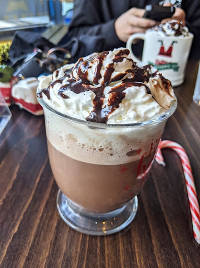 This isn't just hot chocolate&mdash;it's a holiday in a glass, crowned with a cloud of whipped cream and chocolate drizzle.