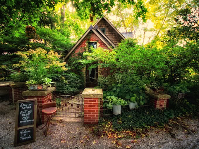 The cottage looks like it was plucked from a storybook, complete with the "follow these paths" sign that's impossible to resist.