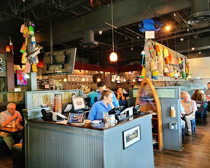 The host station, adorned with colorful buoys, serves as mission control for seafood adventures, orchestrating the delicious chaos with nautical flair.