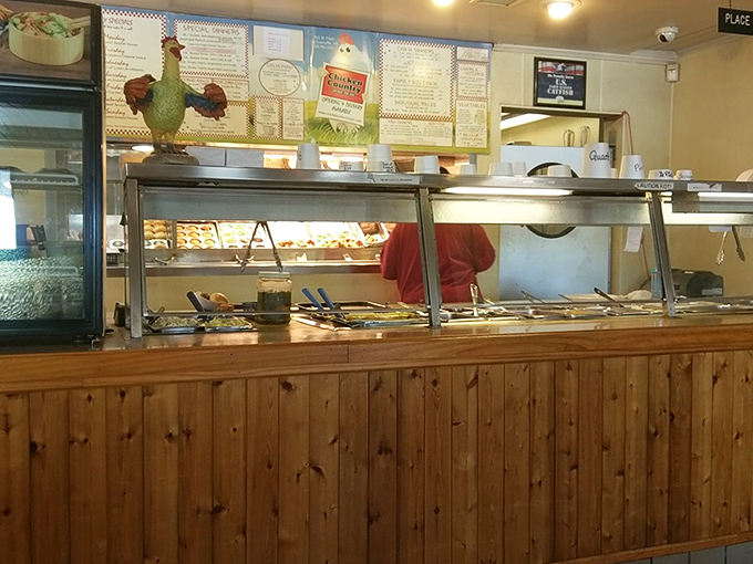 A rooster statue stands guard over the serving line. He's the unofficial quality control manager of this poultry paradise.