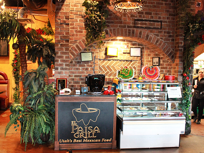 The counter area doubles as a gallery of Mexican culture, where brick arches frame bottles that stand ready to enhance your dining experience.