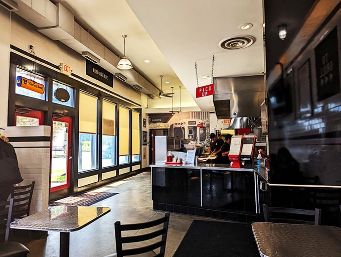 The open kitchen layout lets you witness sandwich artistry in progress – like watching Olympic athletes, except their sport is perfect giardiniera application.