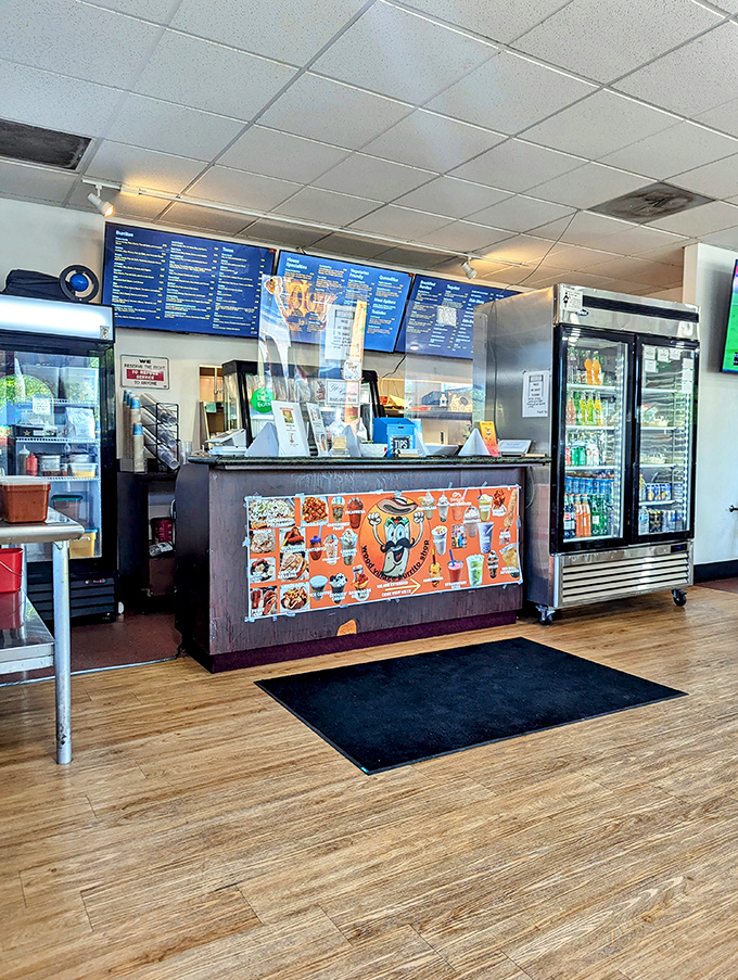 Where the magic happens &ndash; the counter area combines efficiency with personality, featuring that cheerful cartoon mascot who seems to say, "Trust me, you're in good hands."