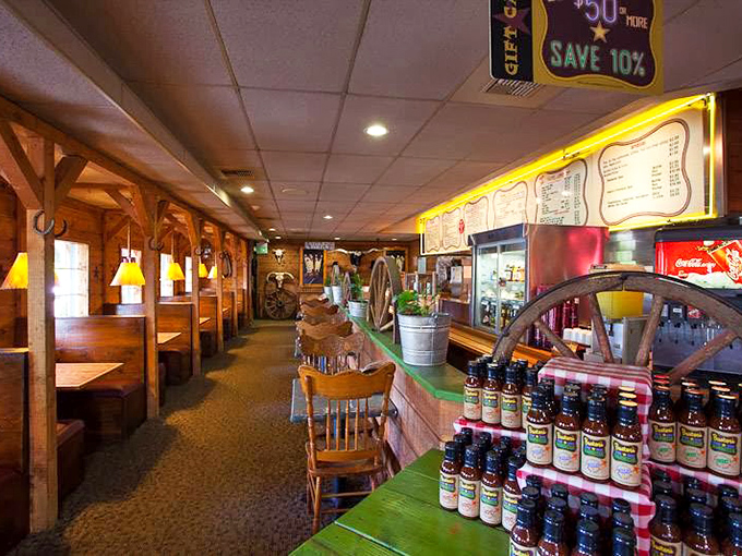 The dining area whispers tales of countless barbecue pilgrimages, where strangers become friends over shared sauce bottles.