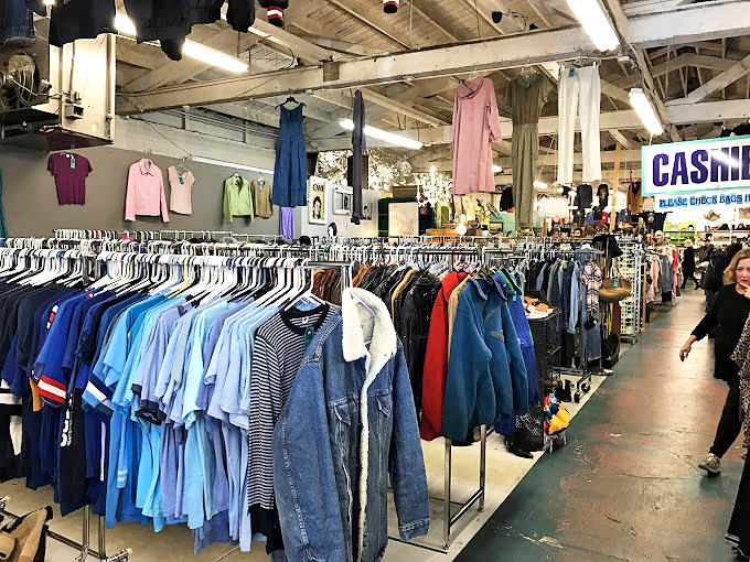 Vintage sunglasses displayed alongside mid-century lamps and furniture create perfect vignettes for imagining how these treasures might transform your space. 