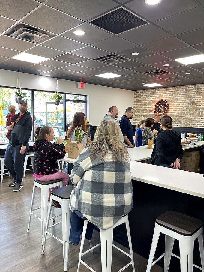 The weekend crowd at DG proves that doughnut enthusiasm crosses all demographic boundaries. Some passions are truly universal.