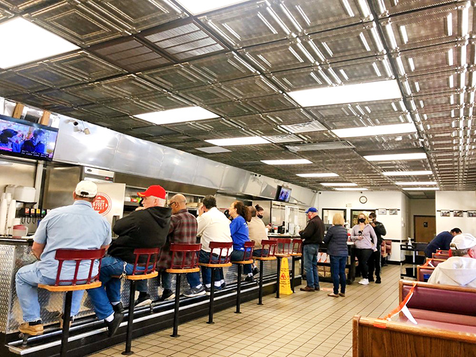 The counter crew&mdash;Greensboro's cross-section of humanity perched on red stools, united by the universal language of good food and hot coffee. 
