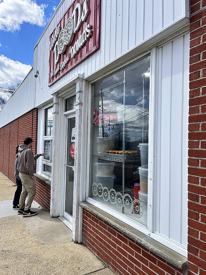 The pilgrimage to donut heaven often requires patience. These devoted followers know that standing in line is just part of the journey.