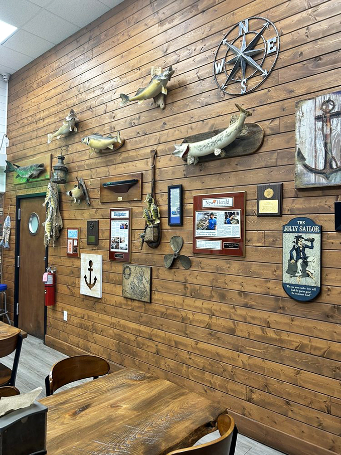 The wall of maritime memories tells stories without saying a word. Fish mounts and nautical artifacts create an atmosphere no designer could replicate.