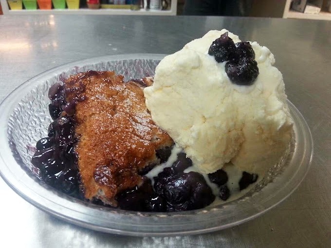 This isn't just dessert—it's therapy on a plate. Warm cobbler meets cold ice cream in a relationship that was clearly meant to be.