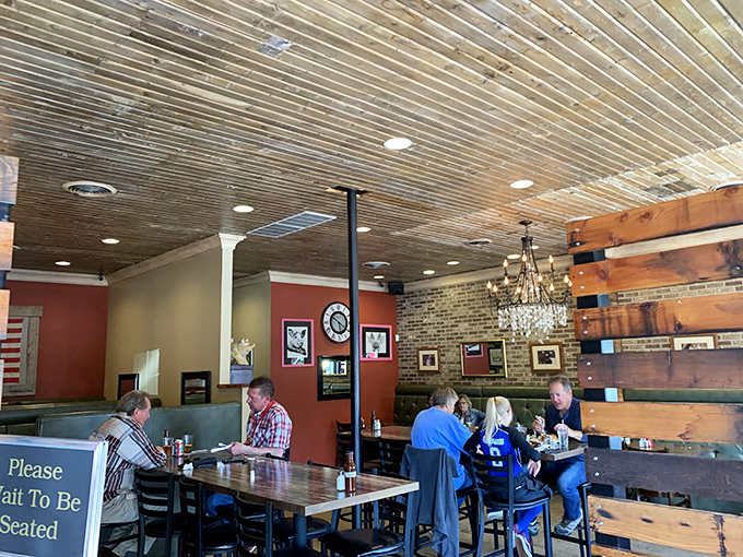 The dining room buzzes with the happy sounds of people making memories over great food. That wooden ceiling adds rustic charm.