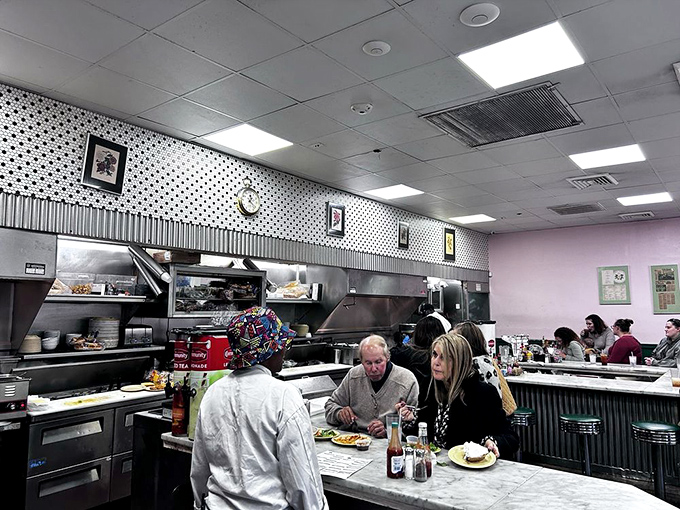 The counter isn't just where you eat&mdash;it's where strangers become temporary friends, united by the universal language of "pass the hot sauce."