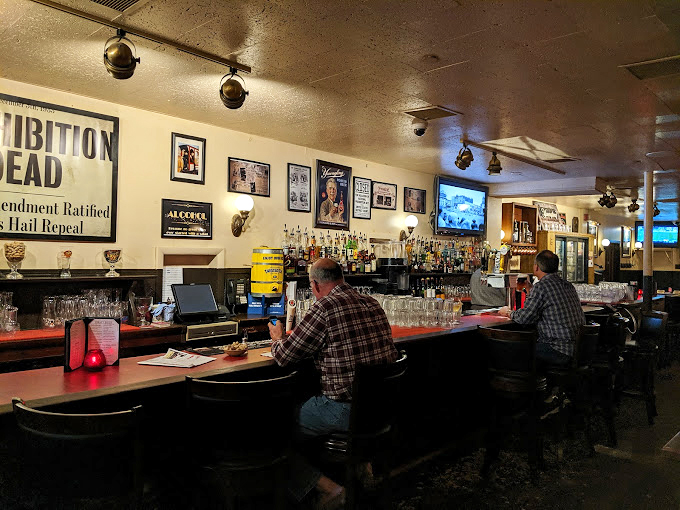 Patrons gather at the bar, where strangers become friends over shared stories and the mutual understanding that calories don't count here.