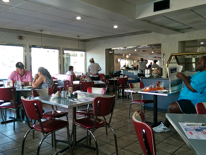 Classic diner ambiance with those unmistakable red chairs&mdash;where strangers become neighbors and everyone's connected by good food. 