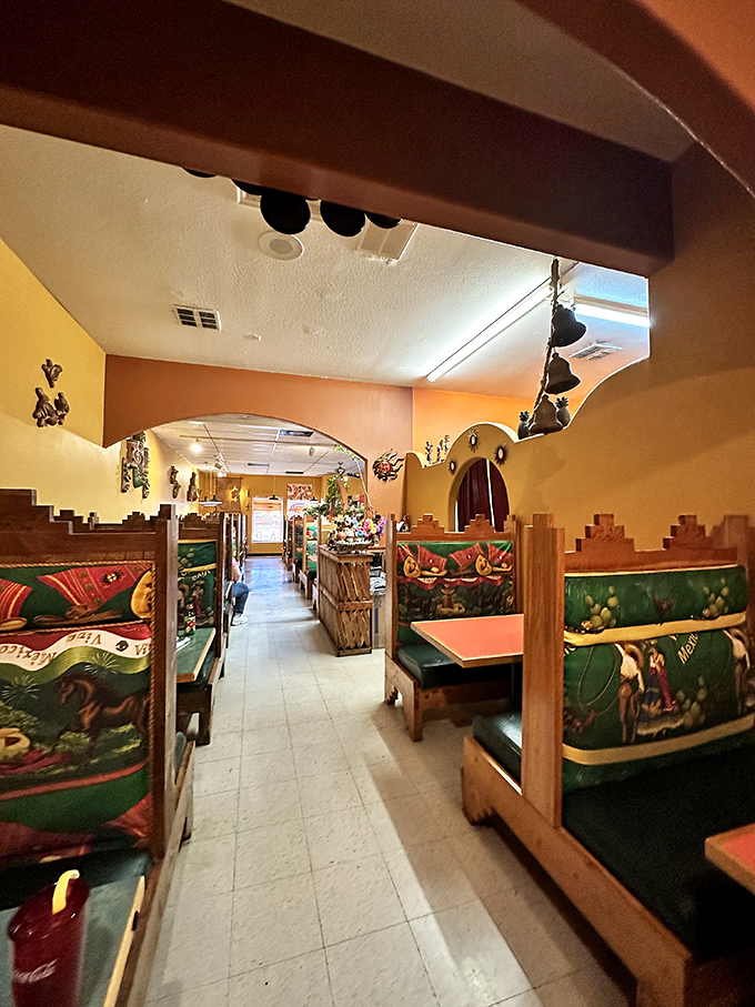 The dining area feels like you've been invited to someone's home in Mexico&mdash;if that someone had impeccable taste in booth upholstery and cultural d&eacute;cor.