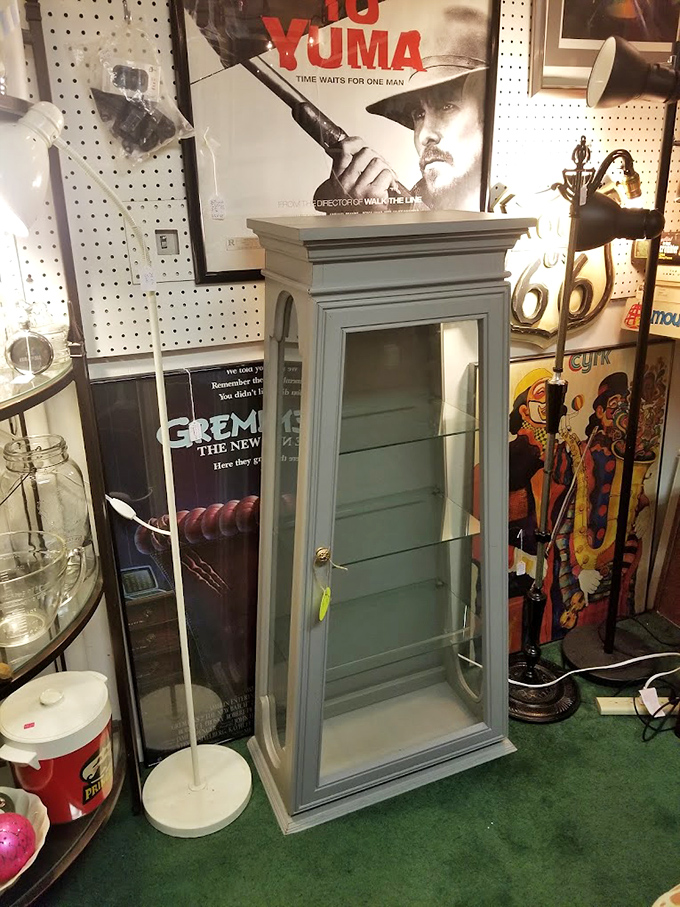 Movie memorabilia and vintage display cases create a museum-worthy corner. That "3:10 to Yuma" poster has stories that rival the film itself.