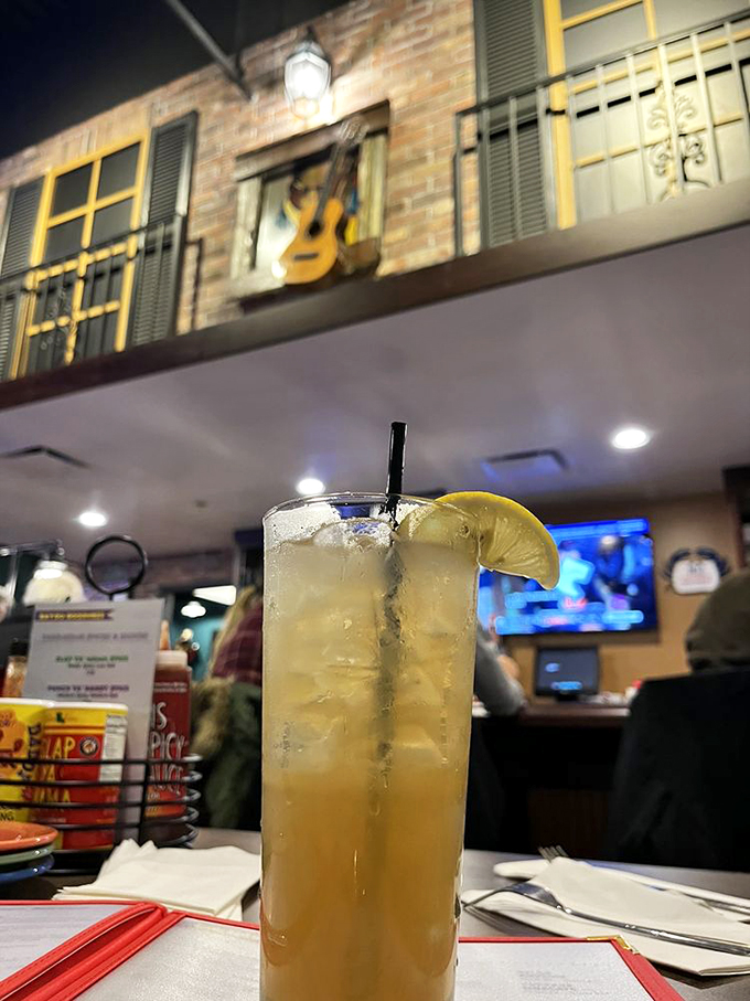 That tall, cool drink isn't just refreshing—it's practically mandatory equipment for tackling spicy Cajun specialties. Lemon slice for the win!