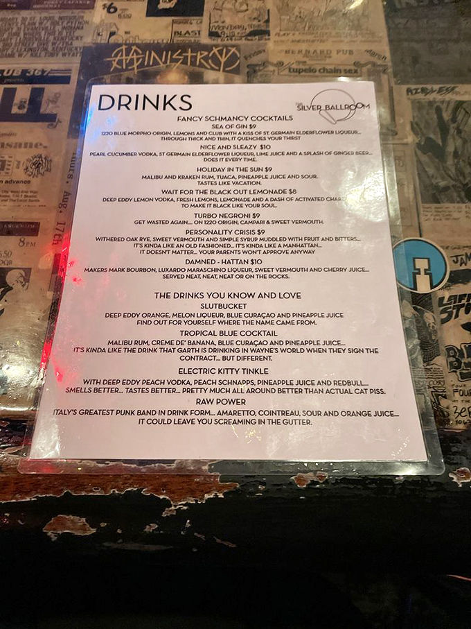 A drinks menu that doesn't take itself too seriously—where "Slutbucket" and "Electric Kitty Tinkle" cocktails prove bar naming conventions deserve to be tilted.