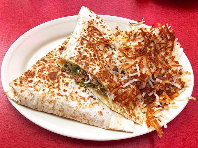 The breakfast quesadilla&mdash;where tortillas fulfill their destiny as vessels for cheese and morning goodness, with hash browns as loyal sidekicks.