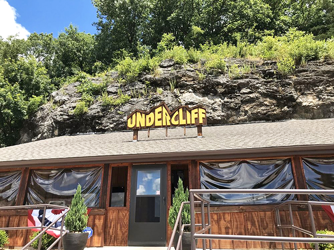 Nature and nurture in perfect balance. The restaurant's wooden fa&ccedil;ade and manicured shrubs create a welcoming entrance to this geological wonder.