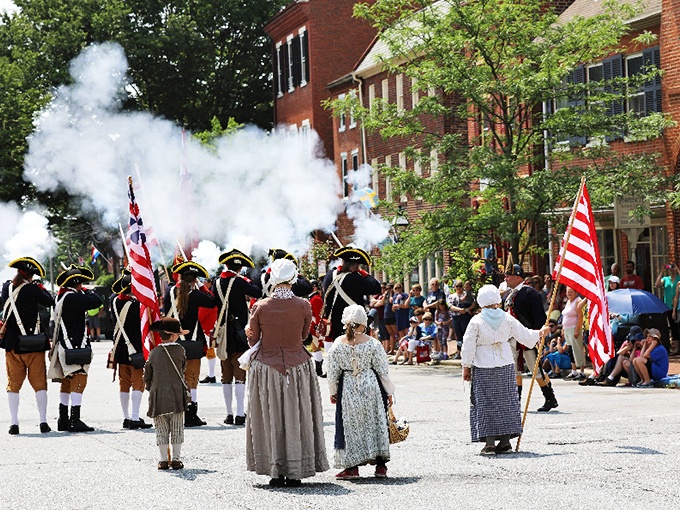 Revolutionary War reenactors bring history to explosive life, proving that educational entertainment existed long before Netflix documentaries.