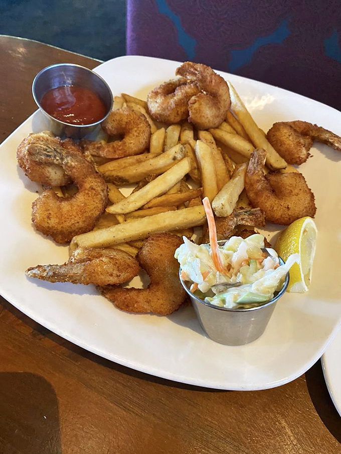 Fried shrimp that somehow manages to be both crispy and succulent, with fries that deserve equal billing rather than sidekick status.