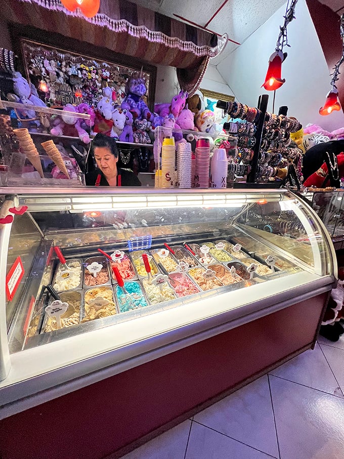 Behind every great gelato counter is a person who knows they're selling happiness by the scoop. The colorful containers are like an edible artist's palette.