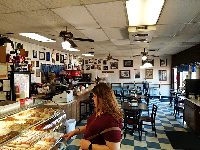Photos on the walls tell stories of community while ceiling fans ensure your donut-eating experience remains perfectly temperate.
