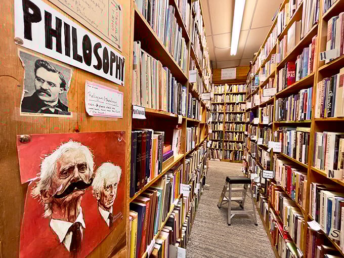 The philosophy section&mdash;where Nietzsche's mustache watches over browsers contemplating life's big questions between these packed wooden shelves.