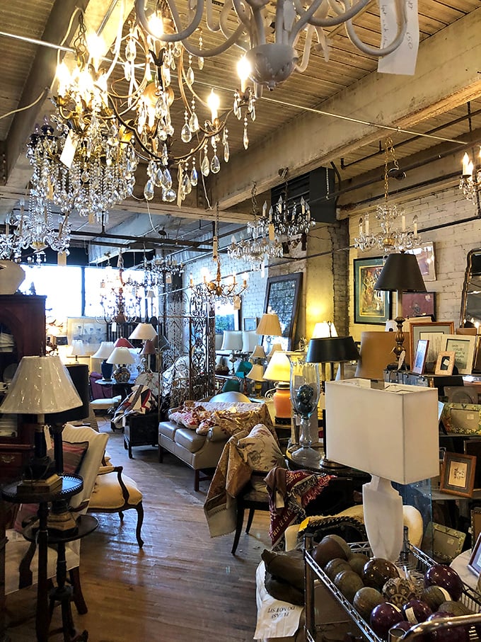 Chandeliers hanging like crystalline clouds, each one having illuminated someone's special moments before finding its way here, waiting for yours.