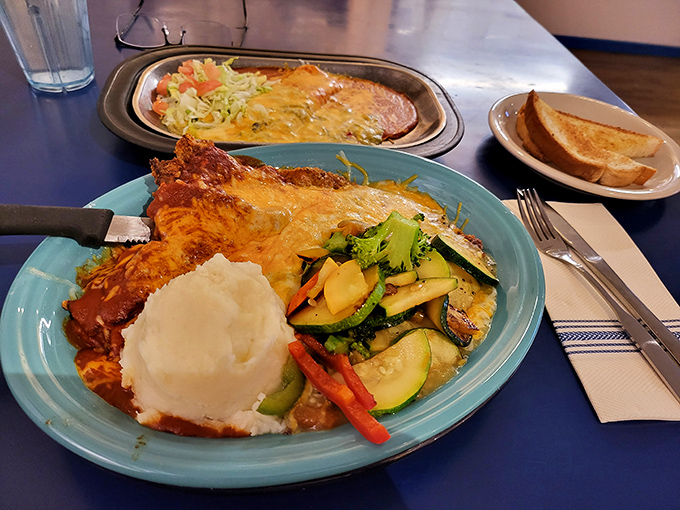 A blue plate with chicken fried steak that whispers, "Your diet starts tomorrow," and mashed potatoes that make you say, "I agree."