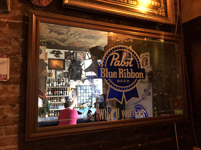 Through the looking glass: a PBR mirror reflects the beautiful chaos of a bar that's remained defiantly itself for generations.