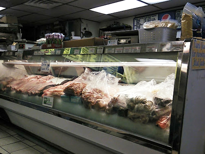 The kitchen pass—that magical portal where raw ingredients transform into crispy, golden morsels of joy that keep locals coming back for decades.