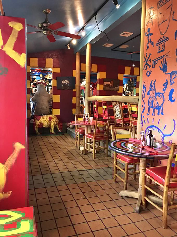 The dining room looks like it was decorated by someone who won a shopping spree at both an art gallery and a carnival supply store.