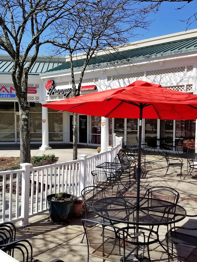 Red umbrellas and wrought iron tables create an outdoor oasis. The perfect spot to enjoy Maryland sunshine with your comfort food.