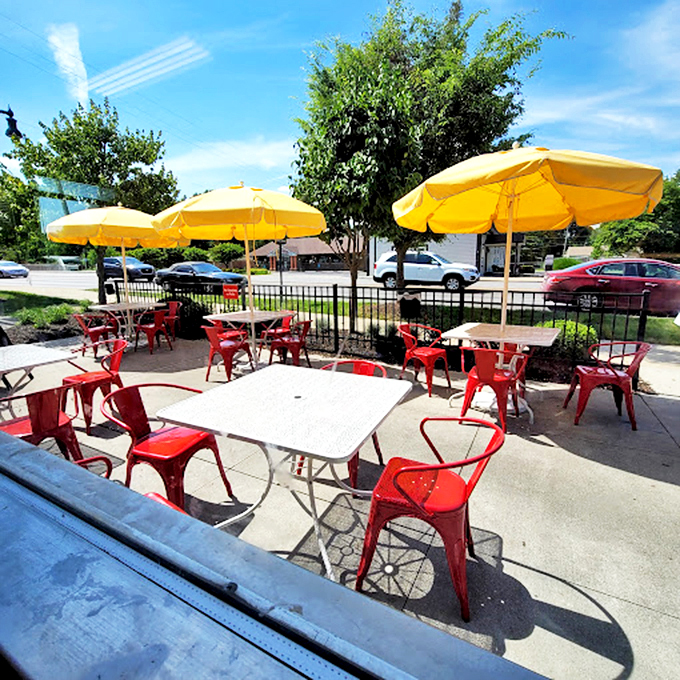 Summer dining al fresco under cheerful yellow umbrellas&mdash;because comfort food tastes even better with a side of sunshine and people-watching.