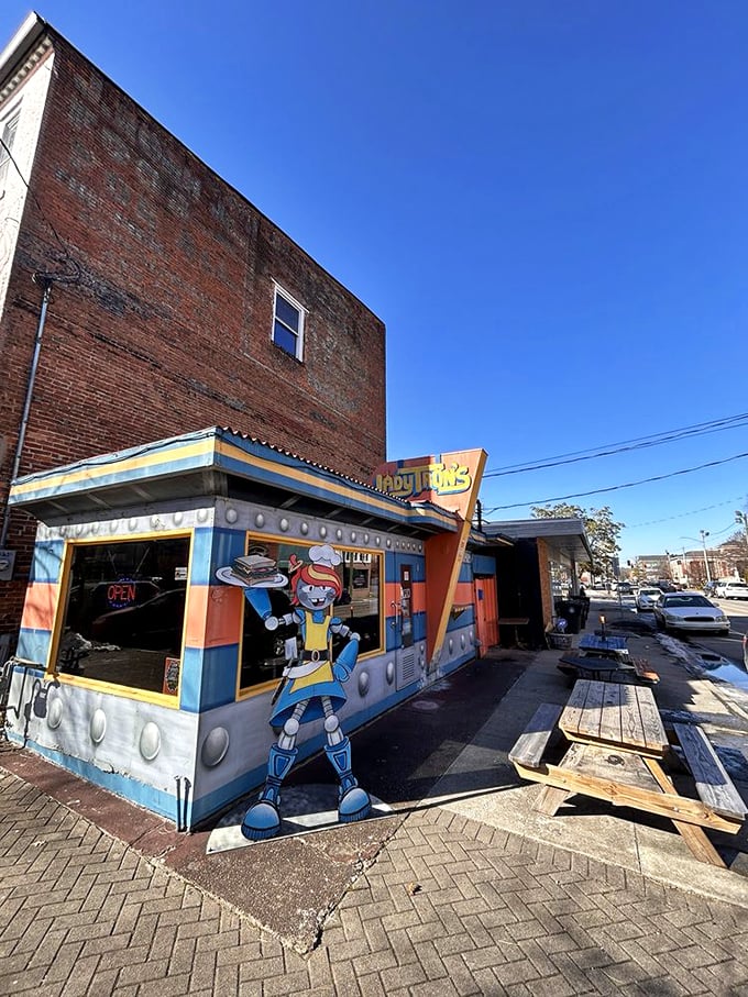 The brick building may be from another century, but Lady Tron's colorful spaceship attachment proves good taste transcends time and architectural norms.